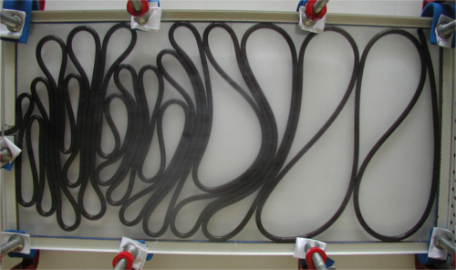 [1703.04201] Tight packing of a flexible rod in two-dimensional cavities.